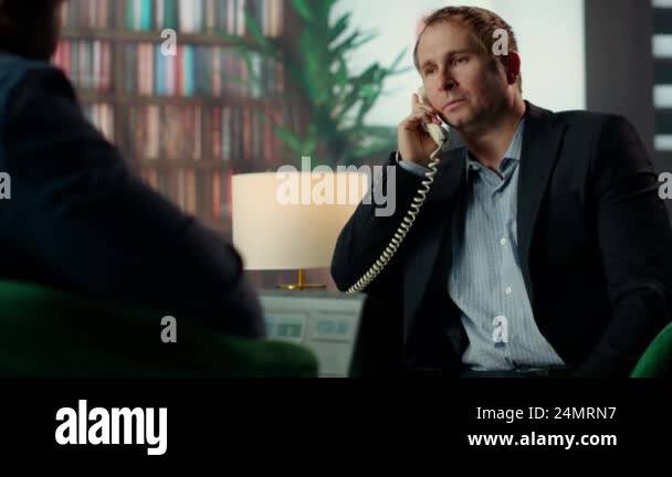 Intelligence officer on a secure line answering phone call in CIA safe ...