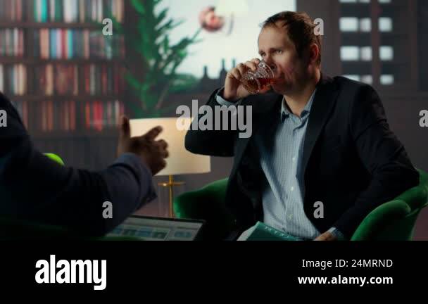 Diverse secret service duo in a CIA library lounge reviewing strategic ...