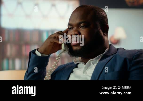 Black professional spy uses a secure landline phone to discuss case ...