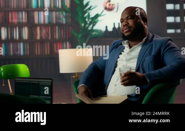 Diverse CIA officers meeting in a safe house library analyzing ...