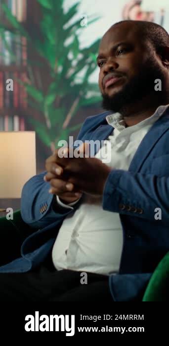 Vertical Video African american secret agent uses a secure CIA landline ...