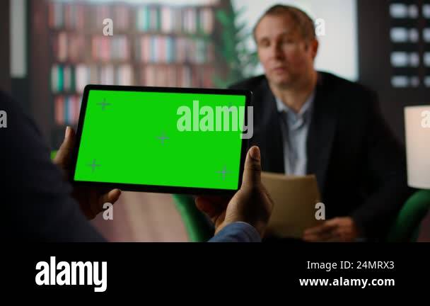 Diverse secret agents examine clues at CIA secret base with a green ...