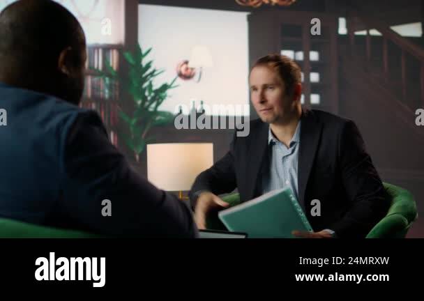 Diverse secret service duo in a CIA library lounge reviewing strategic ...