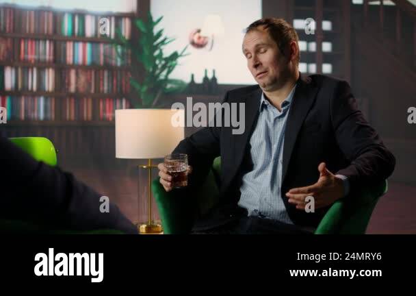 Upper class member drinking too much scotch whiskey with his friend at ...