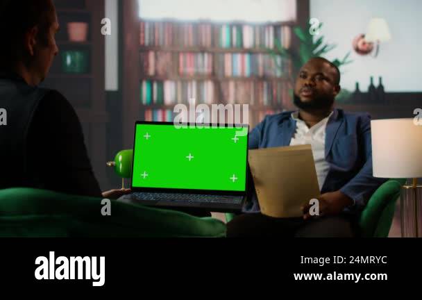 Diverse secret agents discussing next to isolated chroma key on screen ...