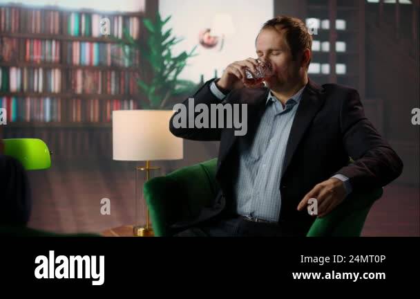 Old money elite gentleman drinking strong whiskey due to stress in a ...