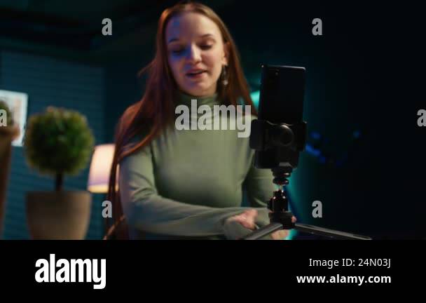 Joyous teenager filming content for online streaming channel in ...