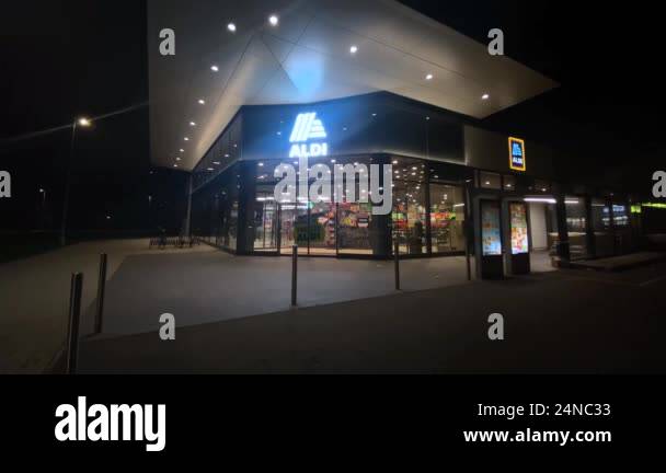 Cremona, Italy - December 9th 2024 Illuminated facade of a modern ALDI ...