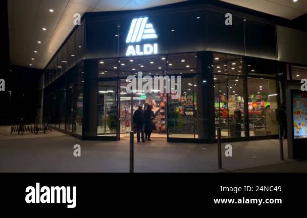 Cremona, Italy - December 9th 2024 Shoppers leaving ALDI supermarket at ...