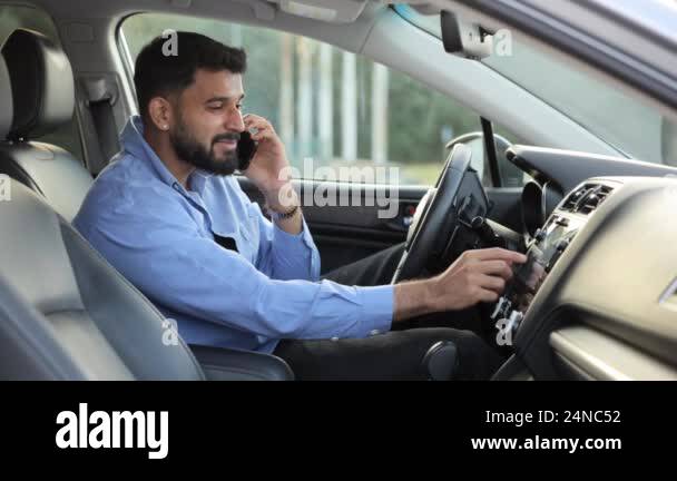 Handsome bearded man in formal clothes, talking on cell phone and ...