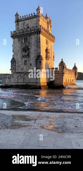 The Belem Tower illuminated by the sunset, situated along the Tagus ...