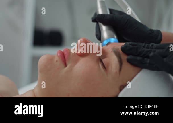 Professional Hydrafacial Procedure by a Cosmetologist Cleansing and ...
