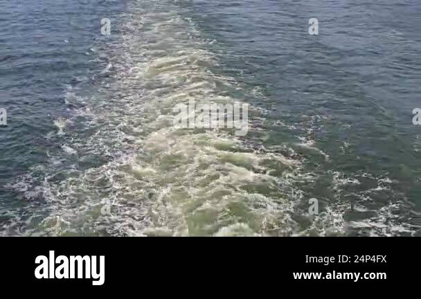 Close-up of water waves and foam, Detailed view of rippling water and ...