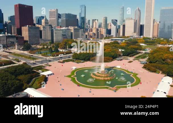 Grand Fountain in Urban Park with City Skyline Background. An expansive ...