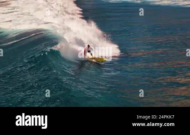 Amateur surfer learns turns when surfing the wave. Aerial view of the ...