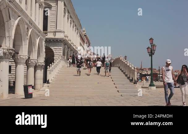 Venice, Italy 1 January 2025: Tourists walking up the steps of the ...