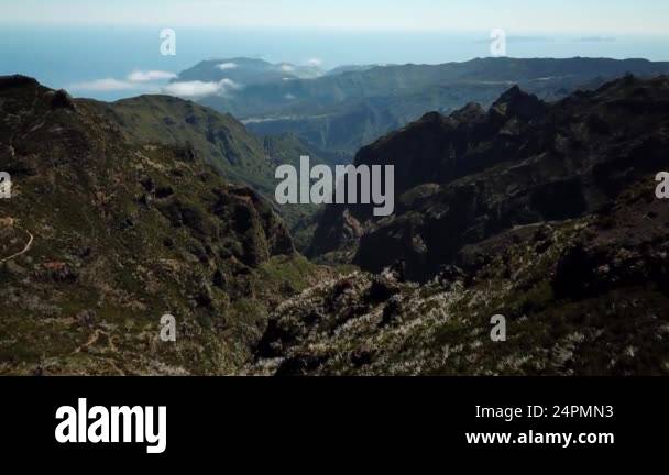 Aerial drone footage over mountains in Madeira Island, Portugal. Pico ...
