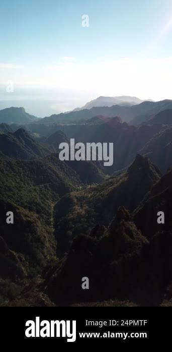 Aerial drone footage over mountains in Madeira Island, Portugal. Pico ...