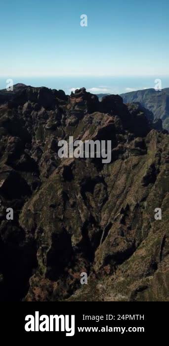 Aerial drone footage over mountains in Madeira Island, Portugal. Pico ...