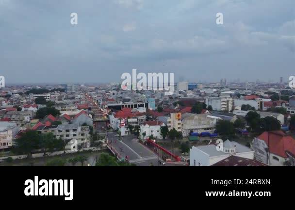 January 9, 2024. Surabaya, Indonesia. Soaring above the bustling old ...