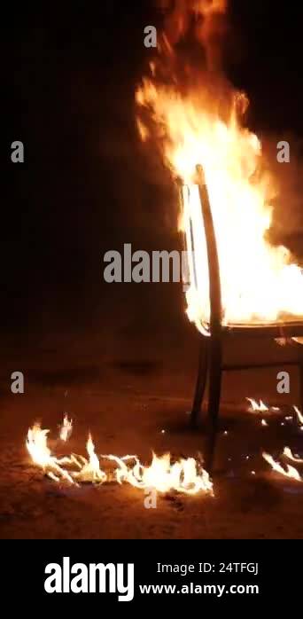 Vertical, The chair is on fire. Big mystical fire at night. A large ...