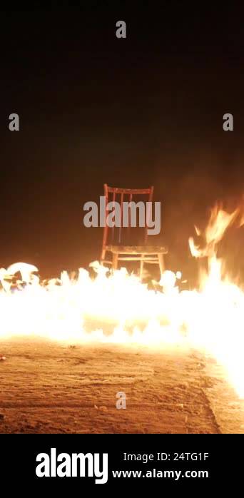 Vertical, The chair is on fire. Big mystical fire at night. A large ...