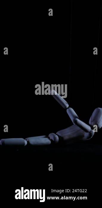 Vertical, Wooden mannequin suspended in darkness. Spooky wooden figure ...