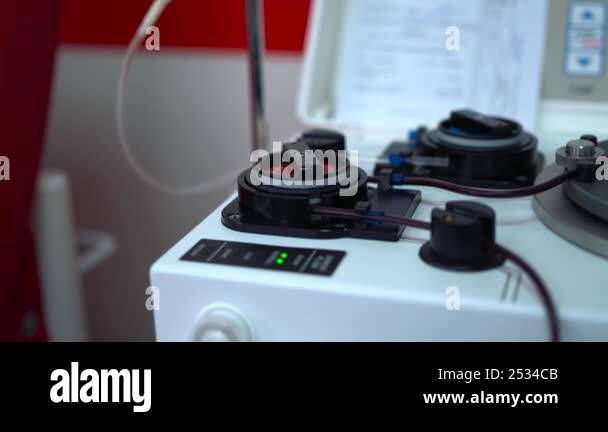 Close-up. blood transfusion machine. blood circulating through ...
