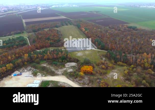 Aerial view of piece of runway at closed airport Flughafen Munchen-Riem ...