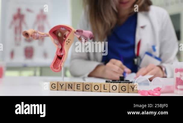 Word Gynecology of blocks with pills and uterus model against woman ...