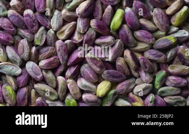 Pistachios texture and background. Pile pistachio kernels nuts without ...