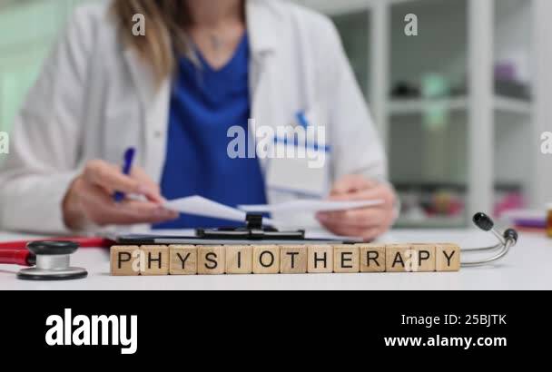 Word Physiotherapy of wood blocks and doctor doing paperwork at desk ...