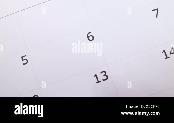 A calendar showing the number 6 with a males hand circling the date ...