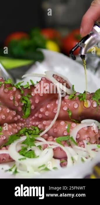 Mediterranean dish of stewed octopus, boiled whole potatoes, seasoned ...