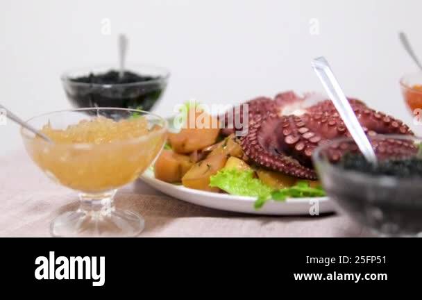Chef preparing Spanish Galician traditional culinary dish, Pulpo A La ...