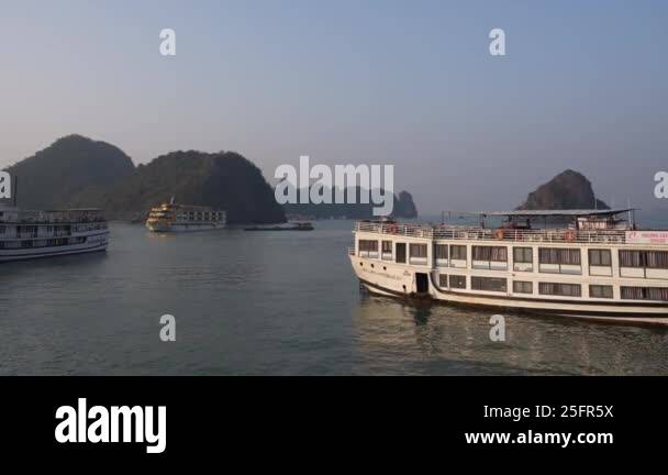 Halong Bay with limestone cliffs and boats in the Gulf of Tonkin north ...