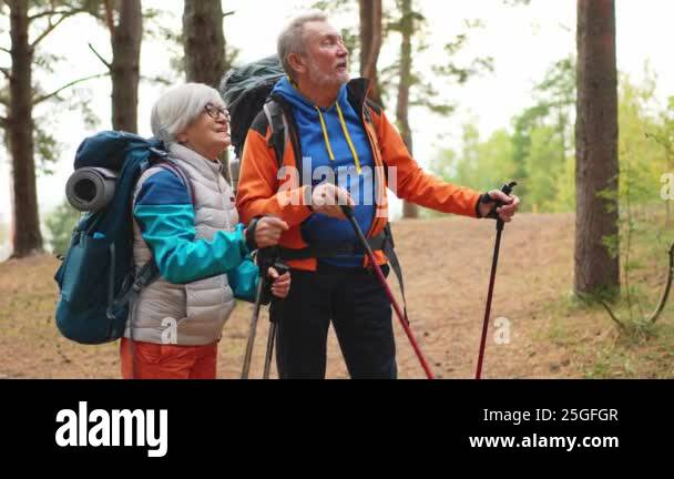 Hiking tourism adventure. Senior couple man woman enjoying outdoor ...