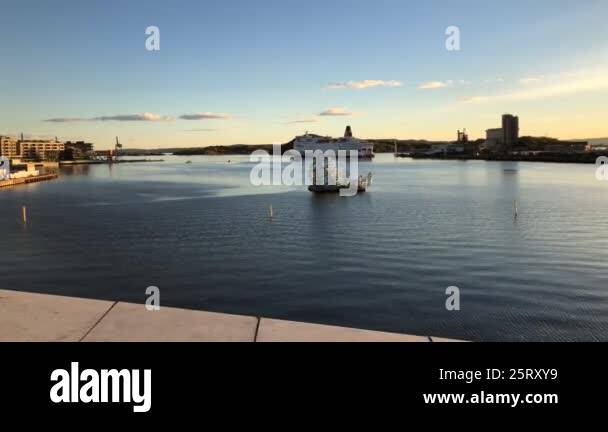 A beautifully serene harbor scene at sunset showcasing calm, reflective ...