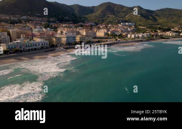 Experience the beauty of Sicily as waves crash against the shore, and ...