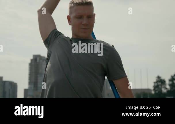 Medium closeup of young professional Caucasian male javelin thrower ...