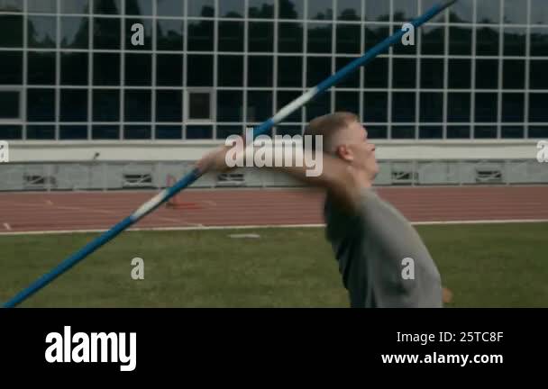 Medium rear side shot of male javelin thrower with acheiria disability ...