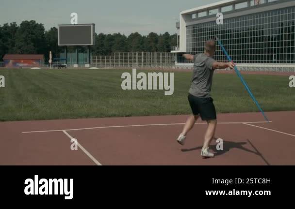 Full rear shot of male para-athlete with missing hand, wearing t-shirt ...