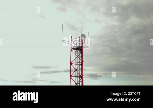 Telecommunication tower against cloudy sky receives signals using antennas. Special equipment ...