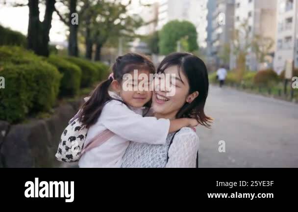 Joyful moments unfold as an asian, japanese mother and daughter share ...