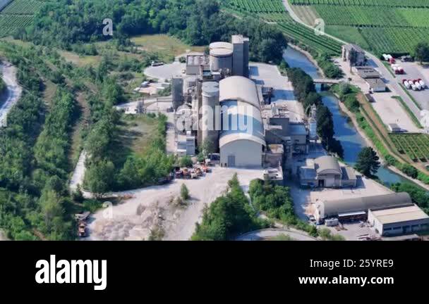 Aerial view of a cement factory in the countryside, showing the ...