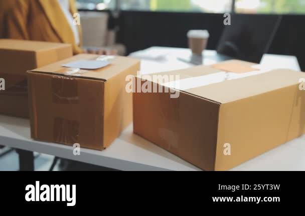 delivery service. man in uniform is preparing to deliver the parcel to ...