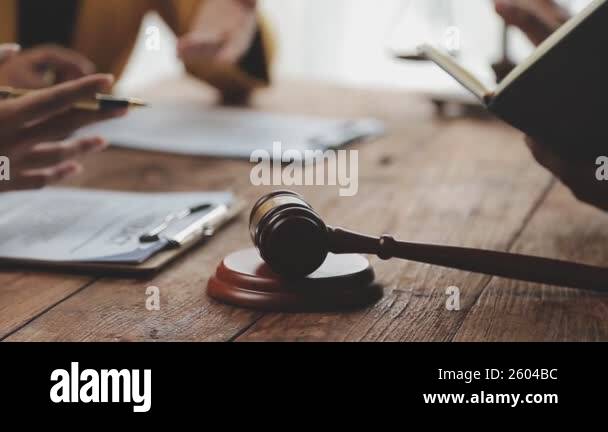 law concept with lawyer, gavel and judge working at the office. legal ...