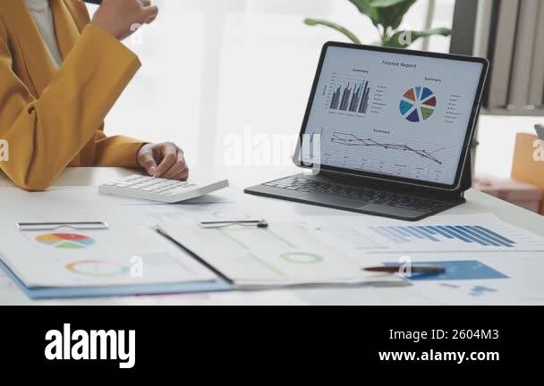 business people working with charts and graphs at table in office. financial planning concept ...
