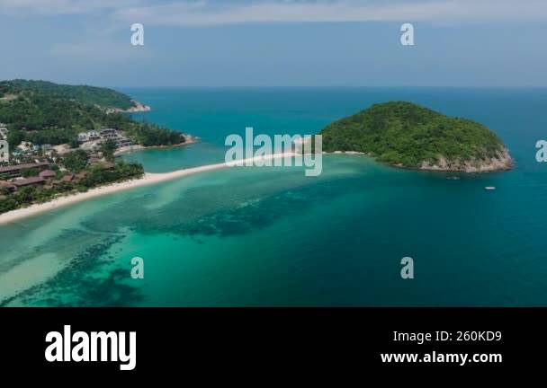 Tropical island with white sandbar surrounded by corals on turquoise ...