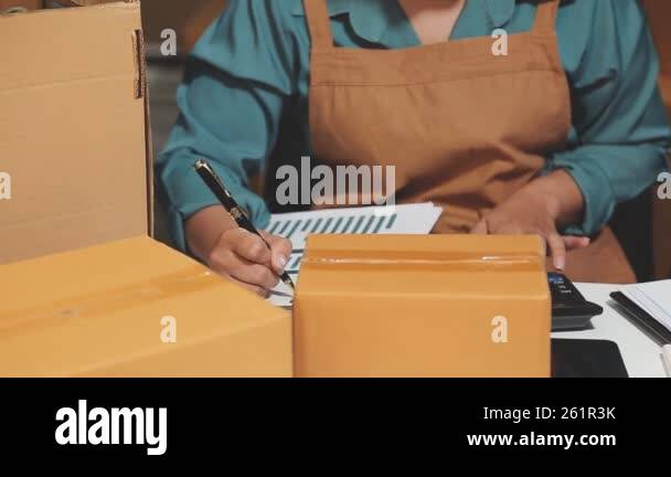 woman hand packing box on desk Stock Video Footage - Alamy